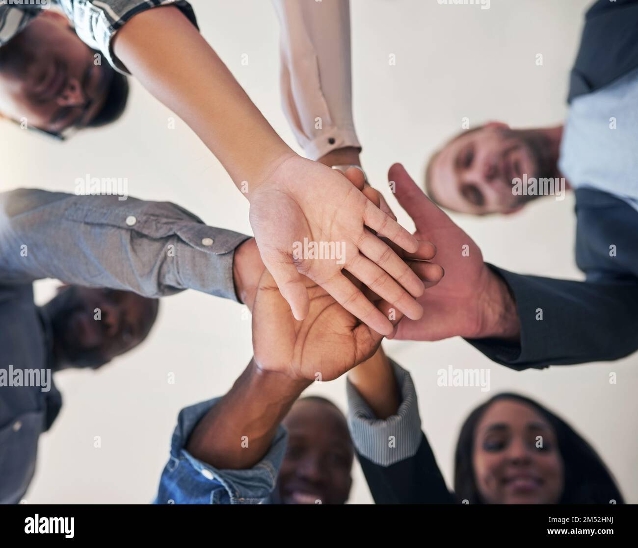 Creative team putting hands hi-res stock photography and images - Alamy