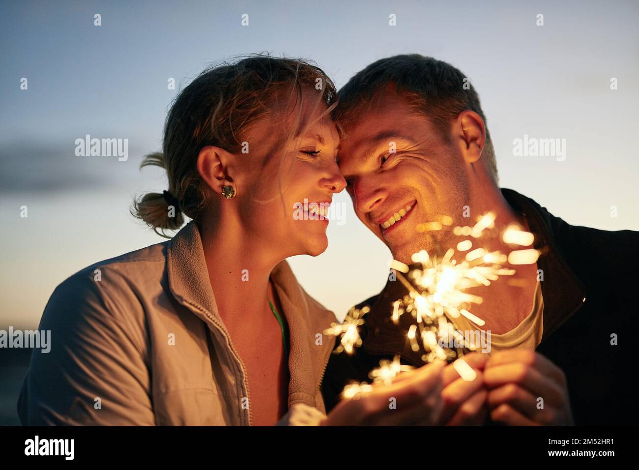 Feeling the spark of new love. a happy young couple playing with ...