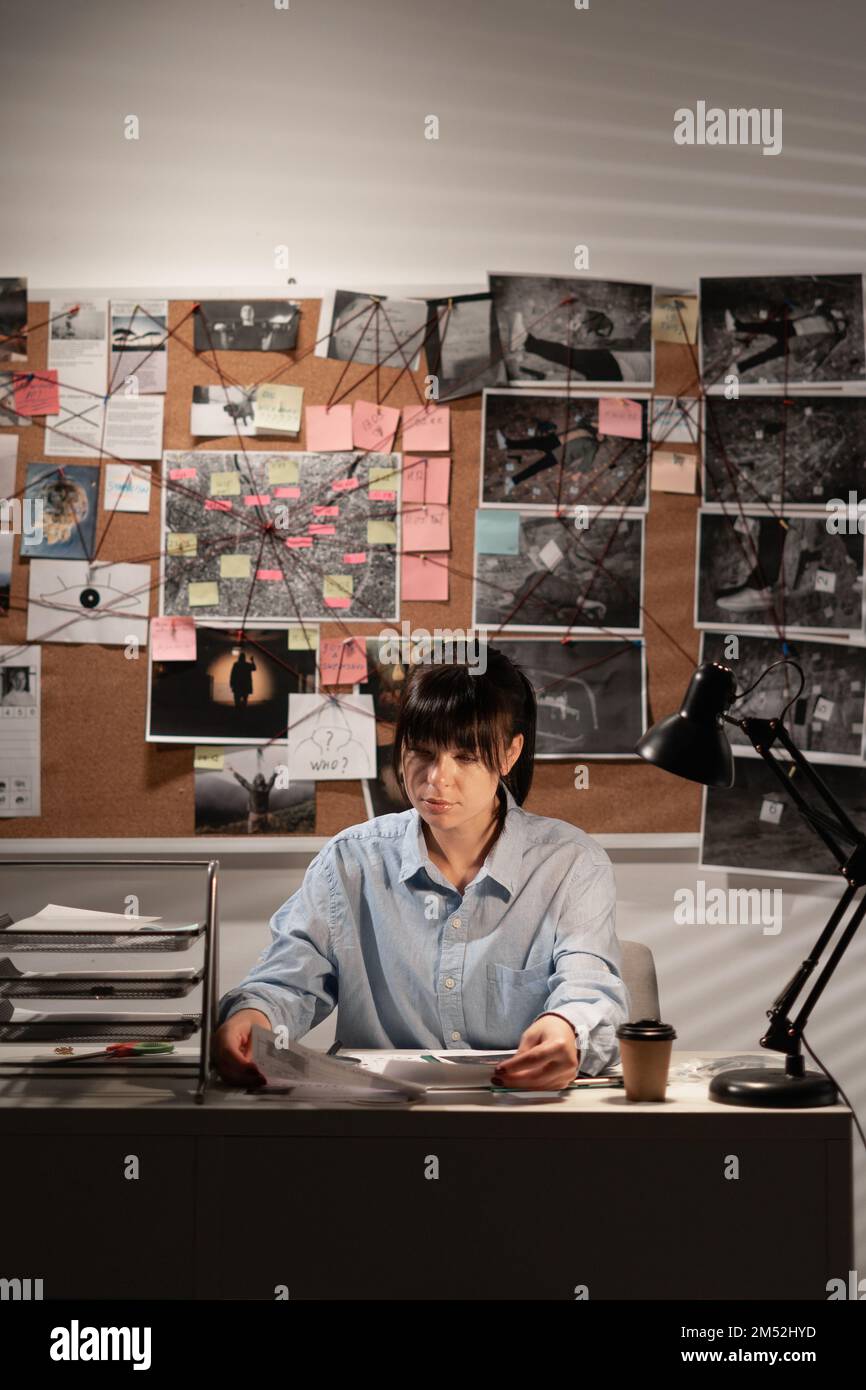 Professional detective working documents hi-res stock photography and ...