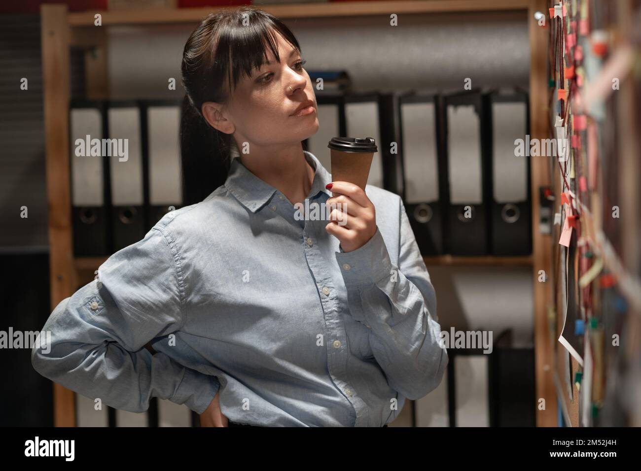 Woman detective searching terrorist act connections, working and ...