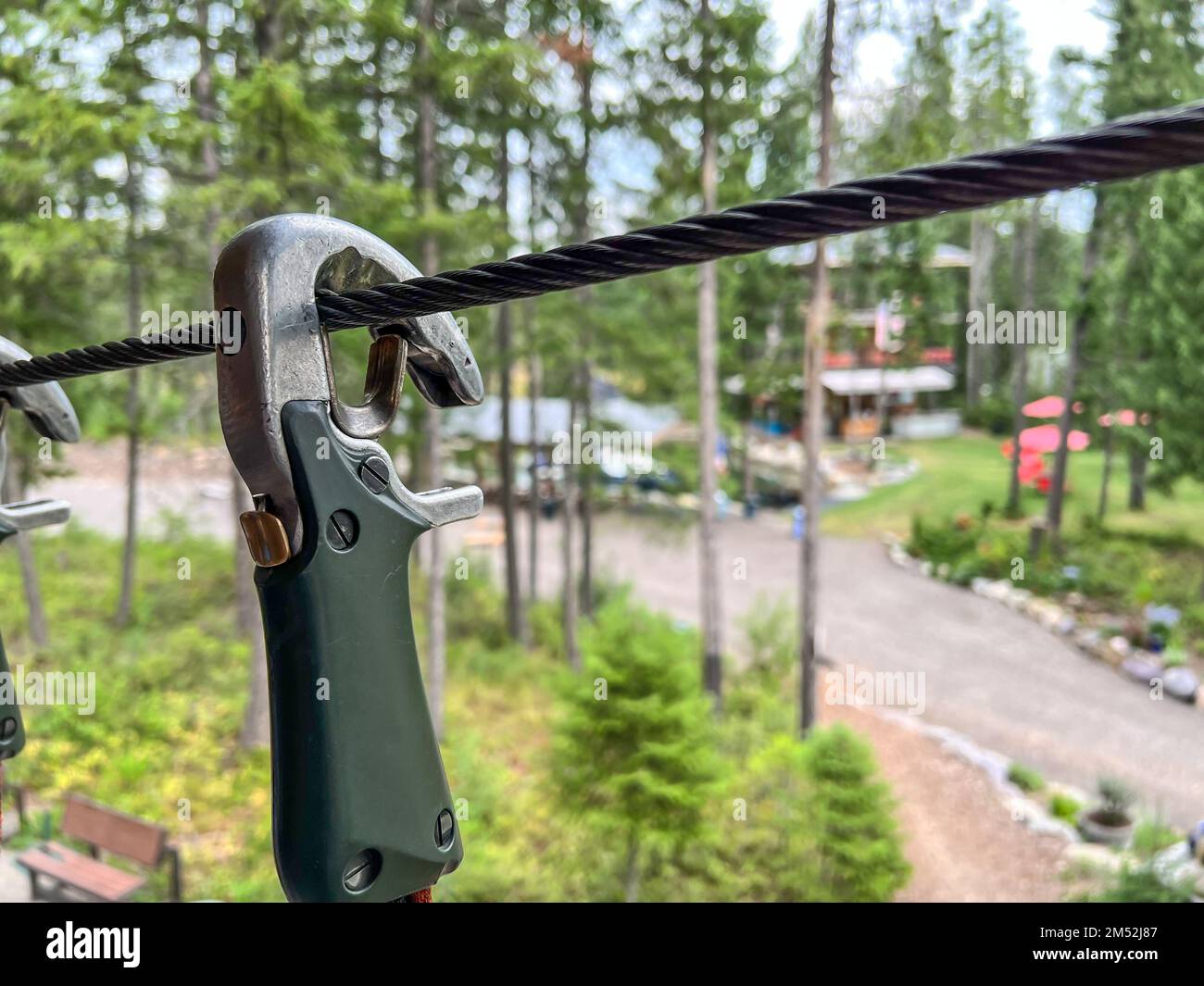 Selective focus on a safety clip used on a high wire ropes course Stock ...