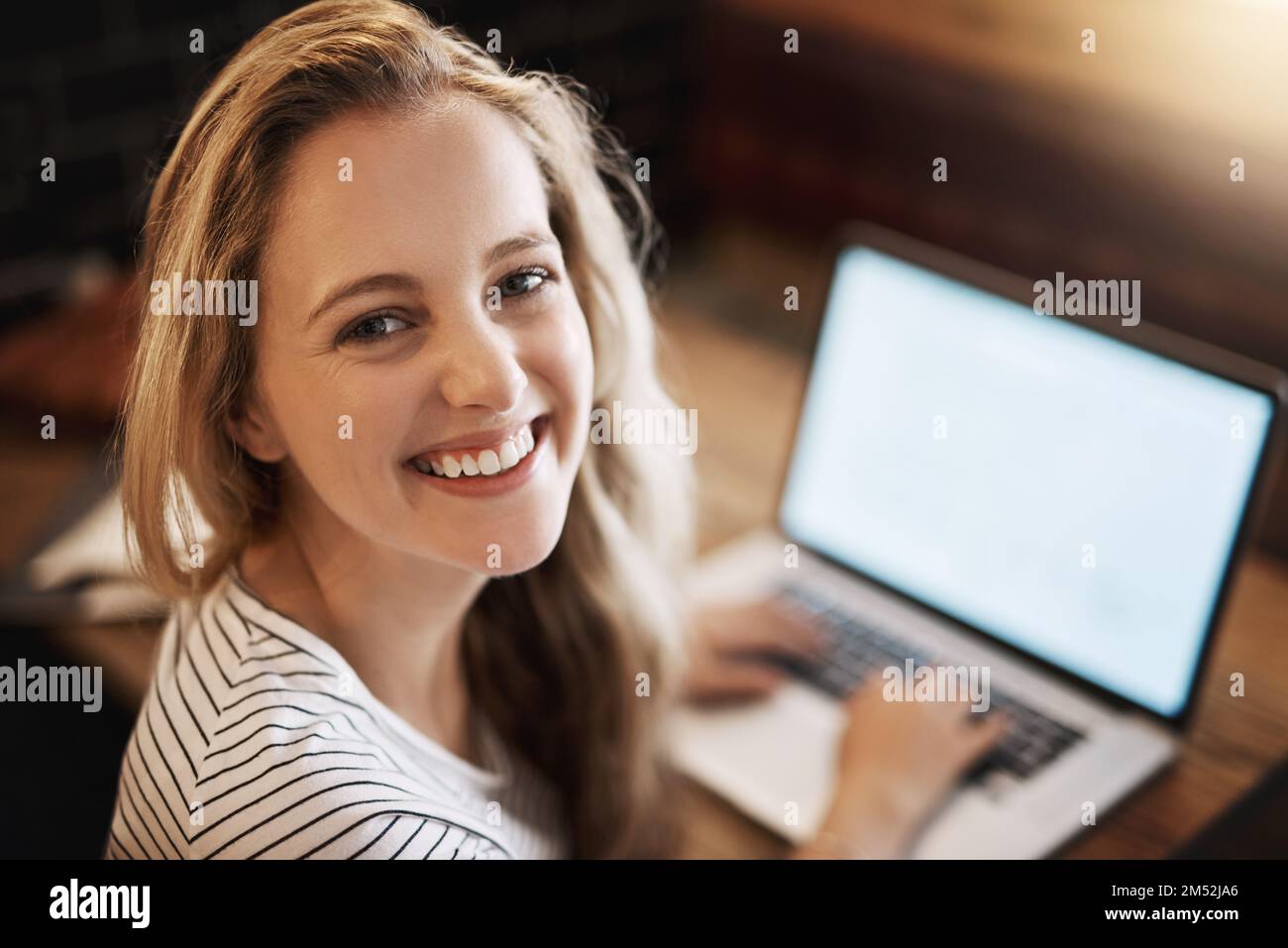 Ill be ready for every exam. High angle portrait of a happy young student using her laptop to ...