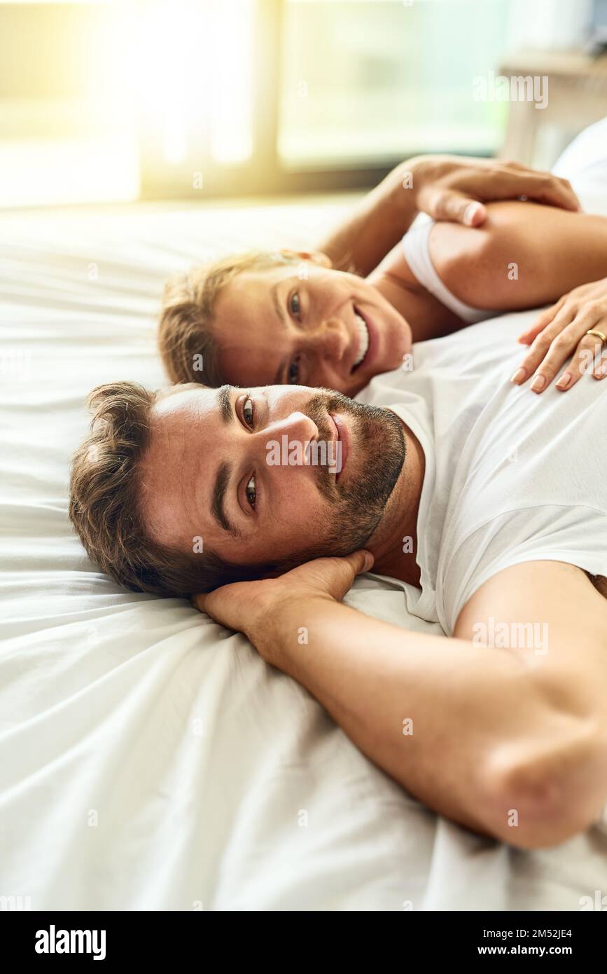 Whats on our Sunday checklist Absolutely nothing. a happy young couple relaxing in bed together ...