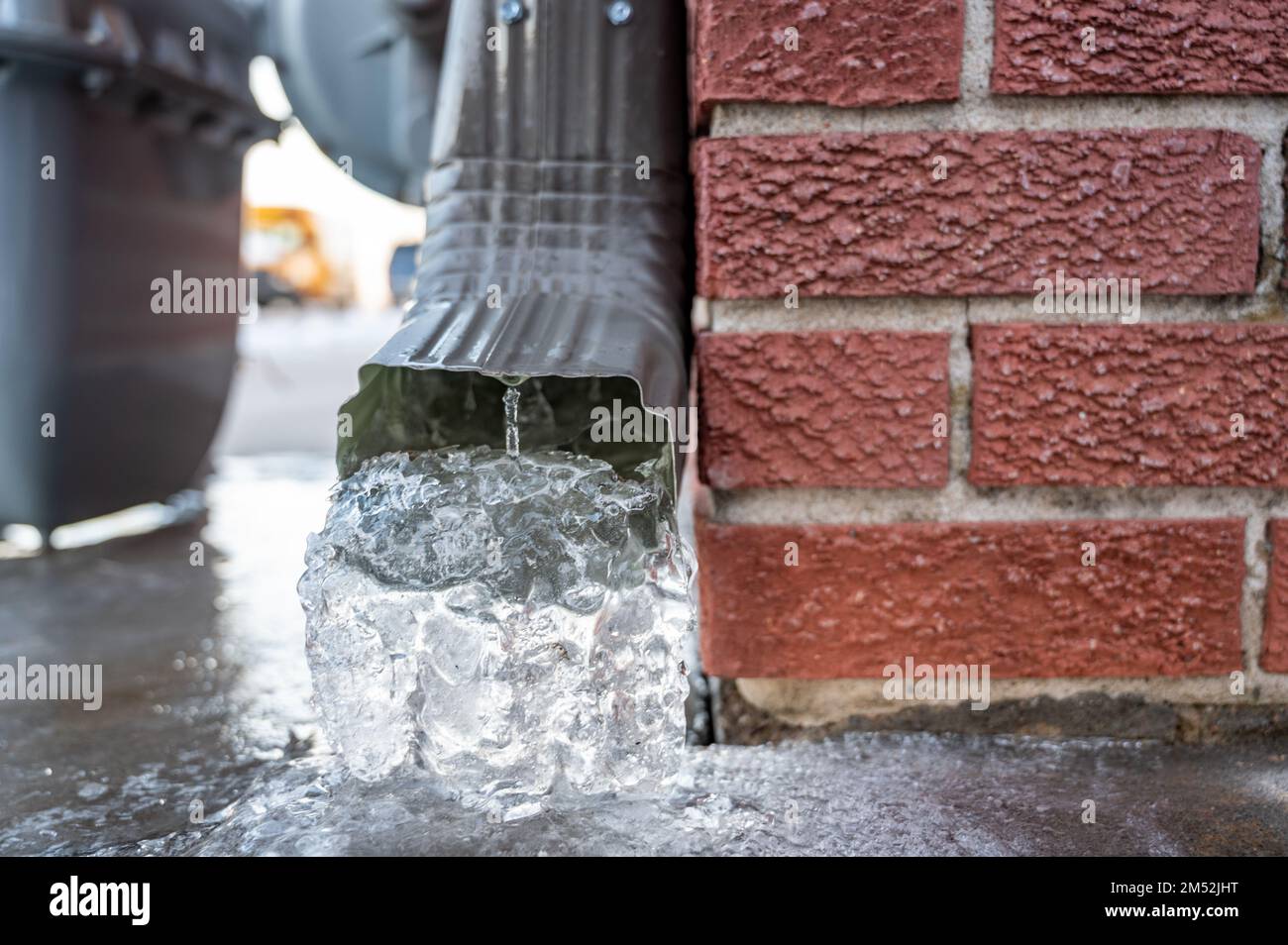 Metal downspout jammed with a frozen ice block Stock Photo - Alamy