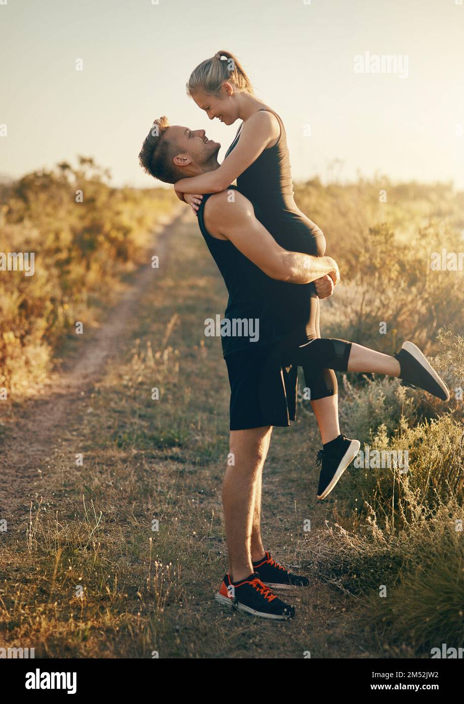 Man lifting woman up hi-res stock photography and images - Alamy