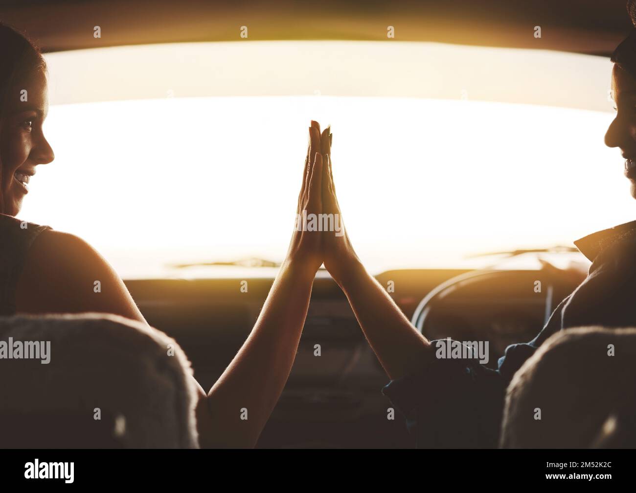 High five for adventures with your bestie. two young friends giving ...