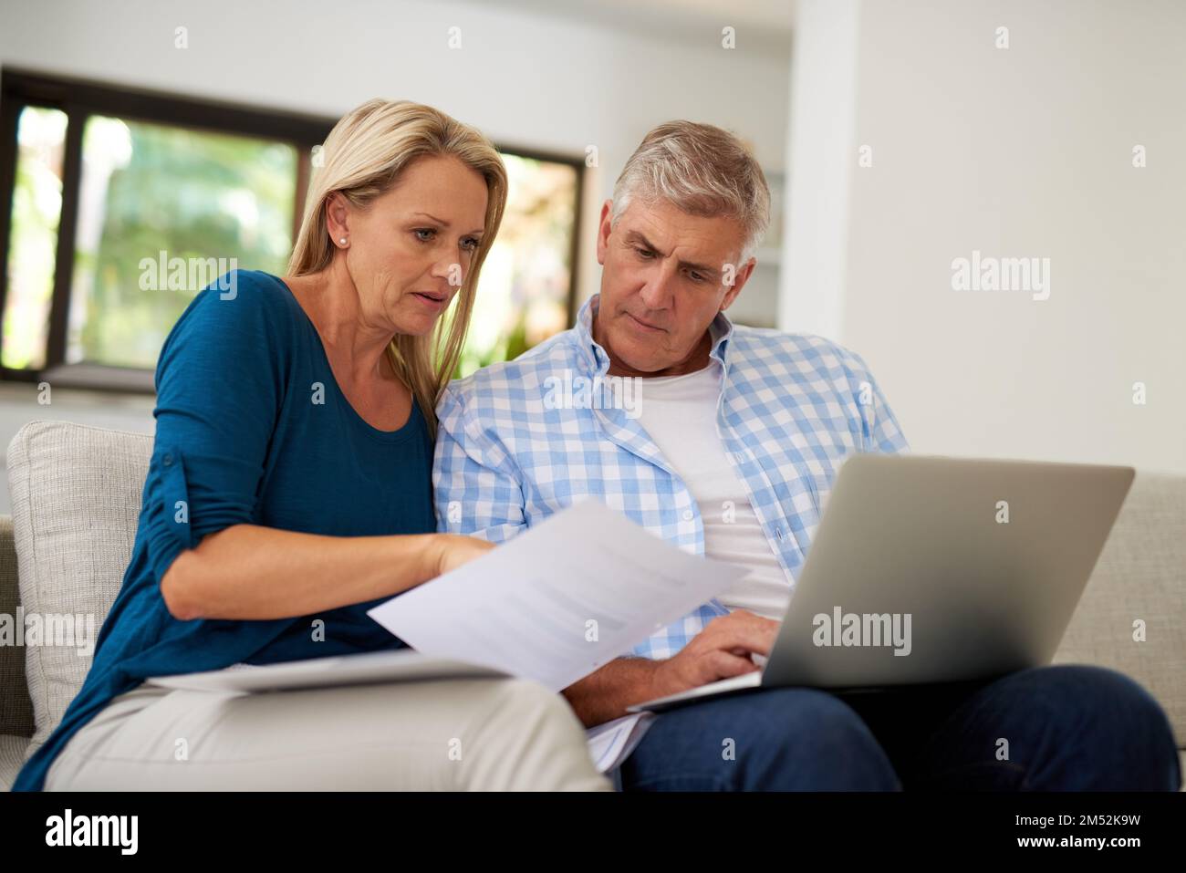 Managing their money together. a mature couple going through their ...