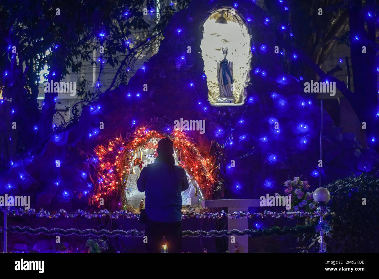 A Christian devotee prays outside the Holy Family Catholic Church on ...