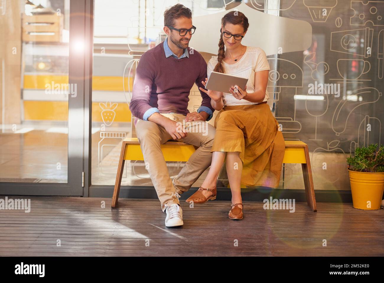 These specials are sure to draw customers to our shop. two happy young ...