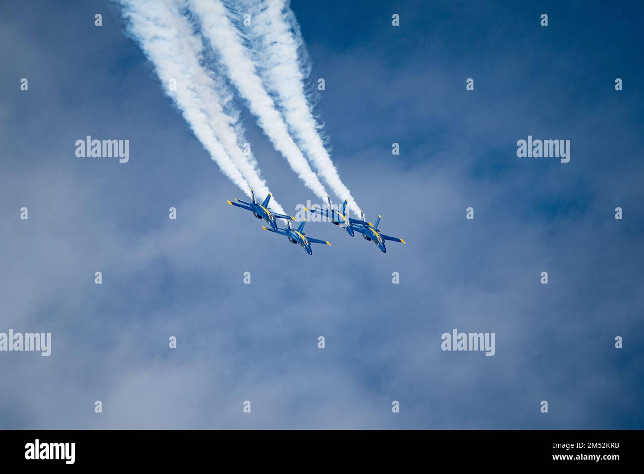 An air show with Blue Angels flying over the town Stock Photo - Alamy