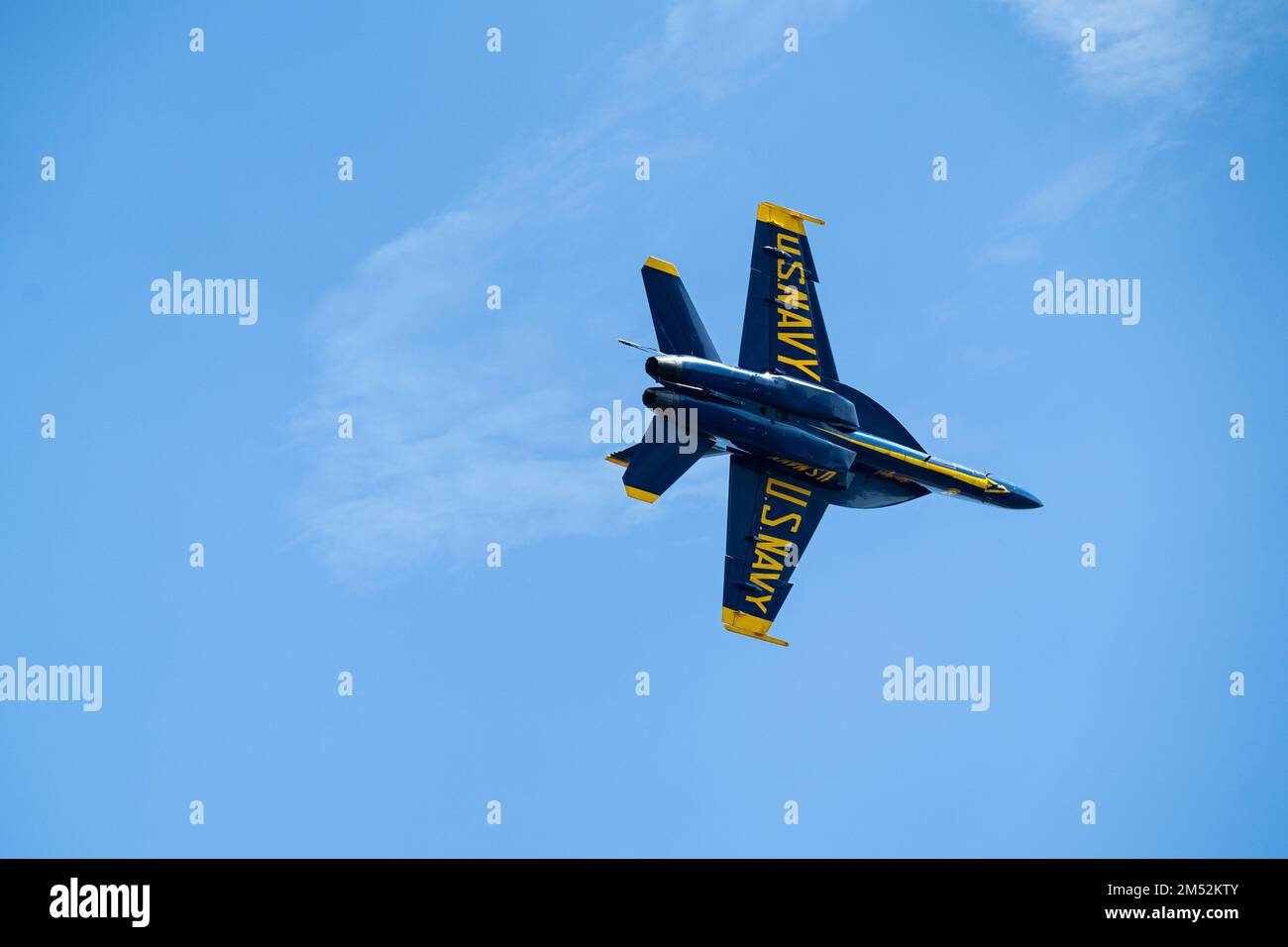 An air show with Blue Angels flying over the town Stock Photo - Alamy