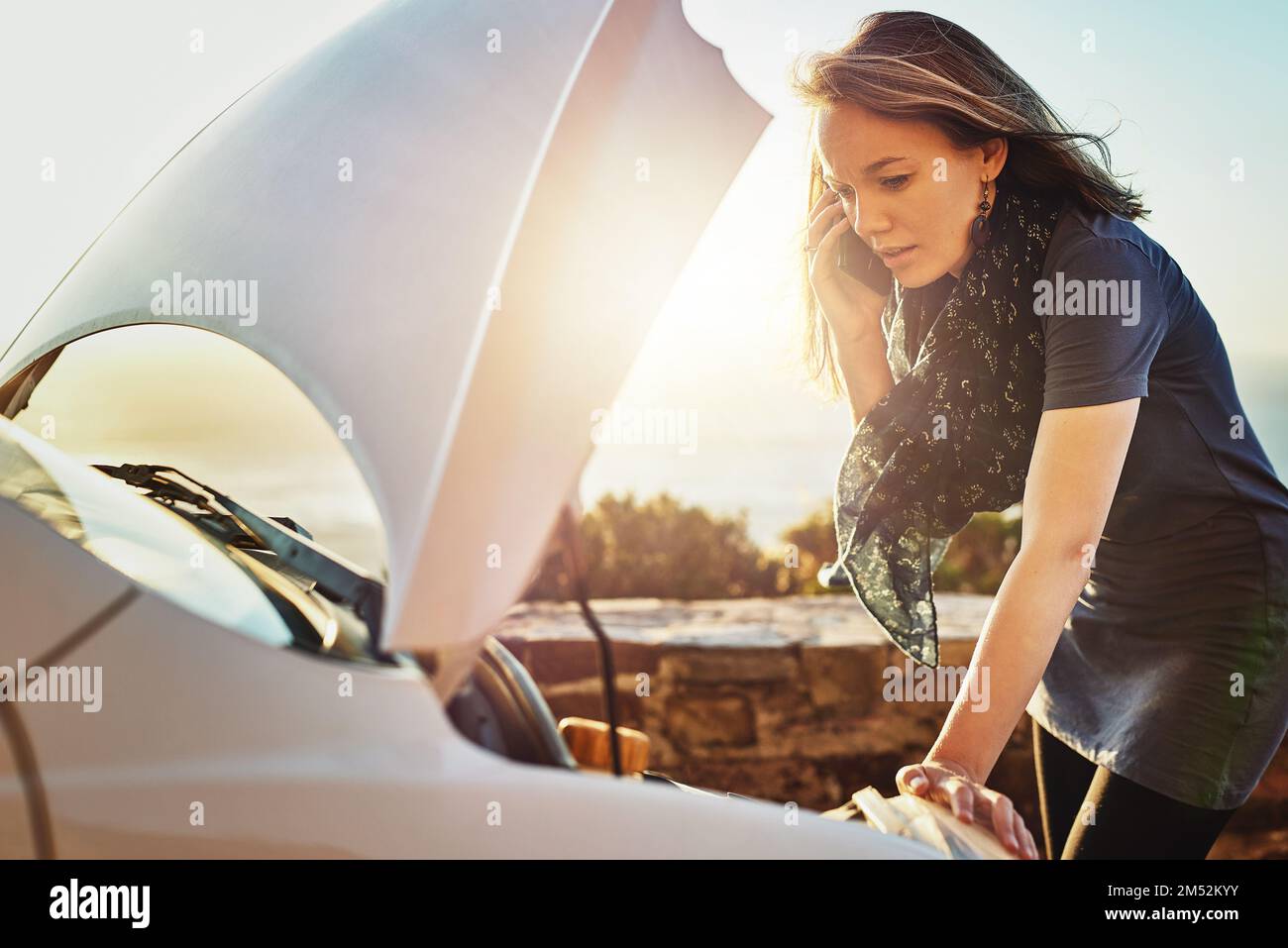 Its an emergency - please come quickly. a young woman calling roadside assistance after breaking ...