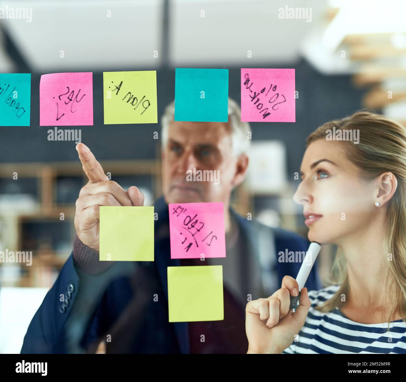 Creative strategizing, how the pros do it. two colleagues having a ...