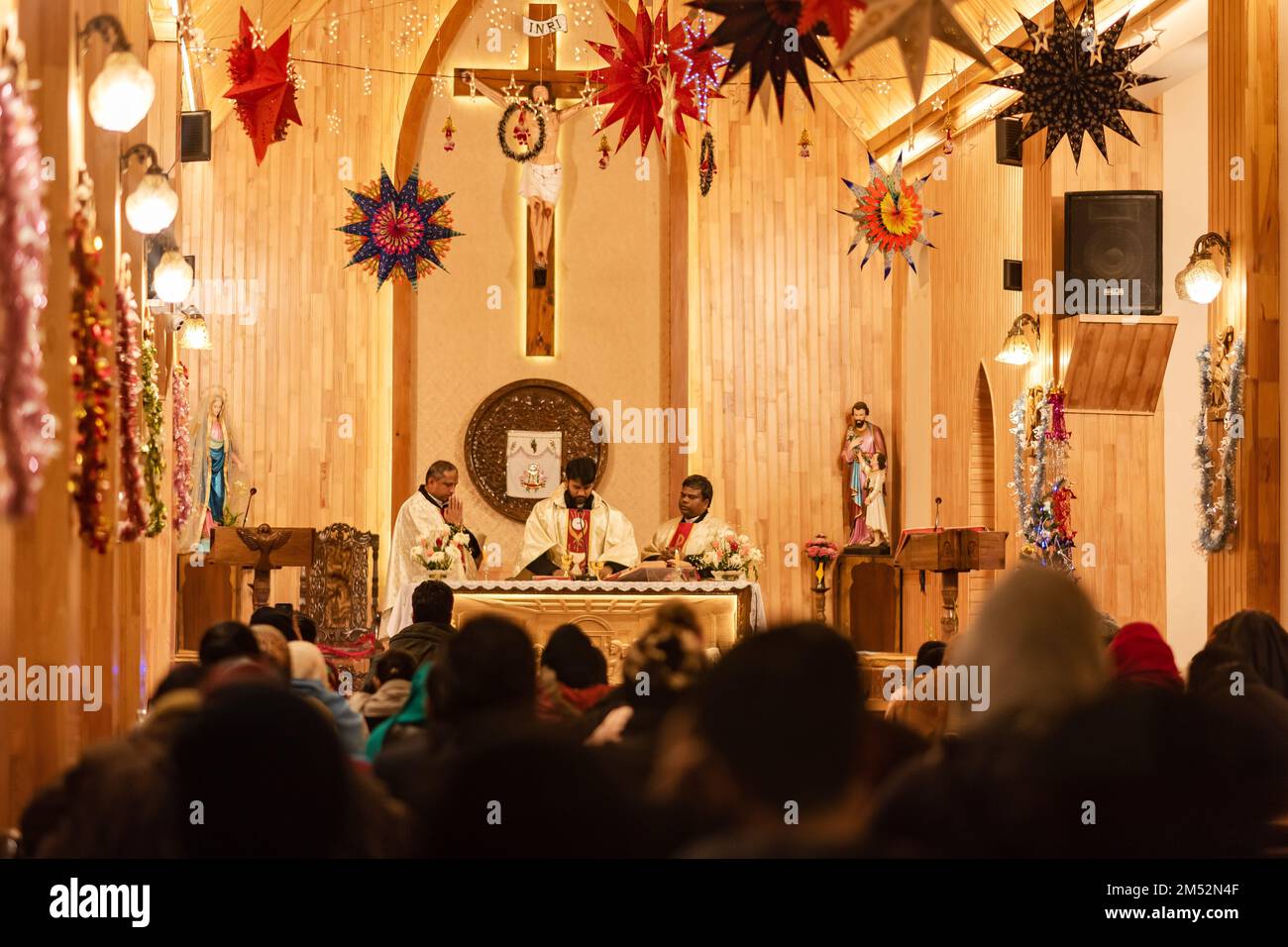 Srinagar, India. 24th Dec, 2022. People offer prayers inside a catholic ...