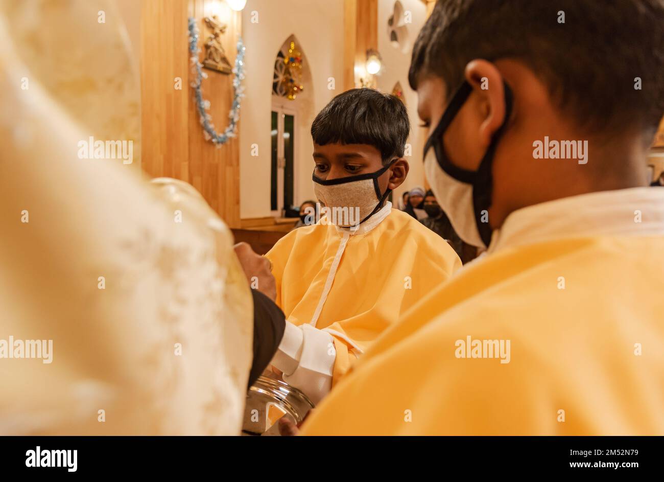 Srinagar, India. 24th Dec, 2022. Catholic priest is seen giving holy ...
