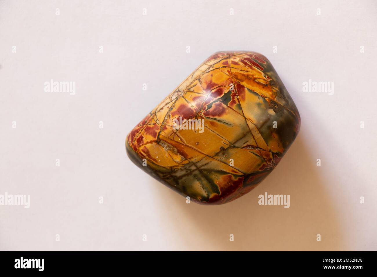 jasper stone on a colored background Stock Photo - Alamy