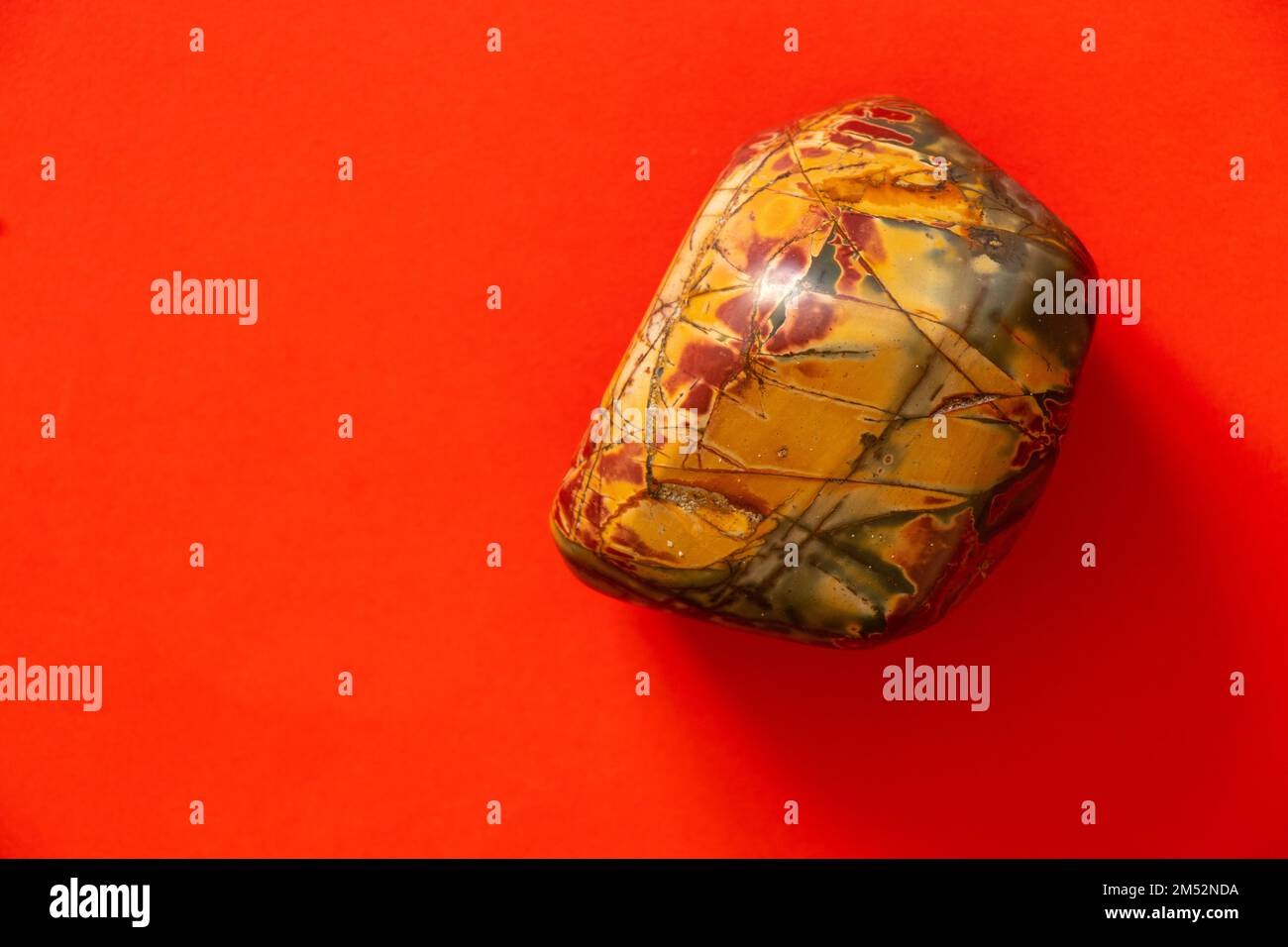 jasper stone on a colored background Stock Photo - Alamy