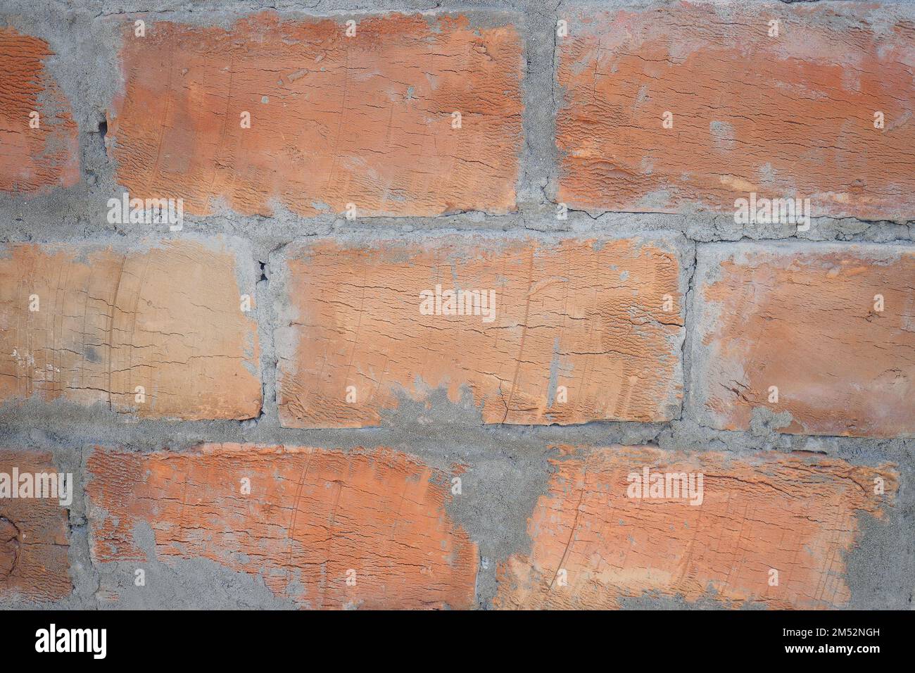 Close-up of red brickwork. Abstract background. Old bricks in cement ...