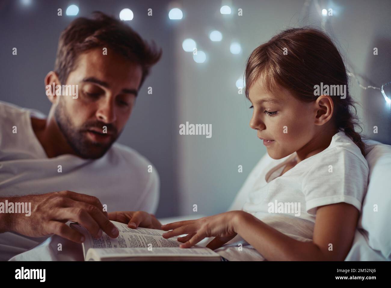 Bedtime Stories Are A Standard Part Of Many Bedtime Routines A Father Reading A Bedtime Story
