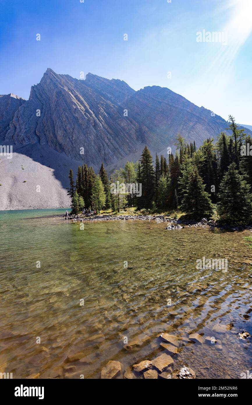 A vertical shot of the lake in front of Mount Chester on a sunny day ...