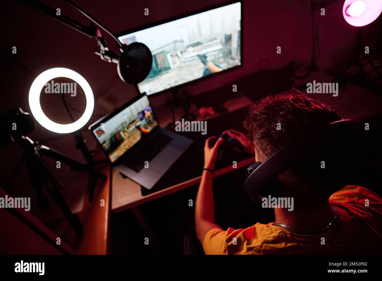 Top view of a gamer sitting in a room playing alone Stock Photo - Alamy