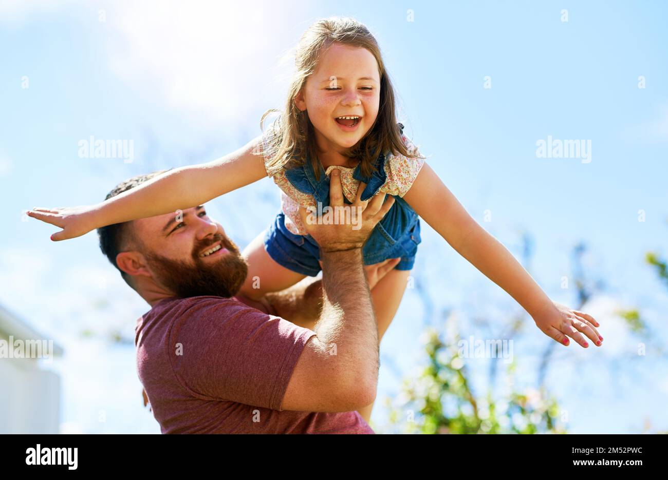 You can fly, my butterfly. an adorable little girl having fun with her ...