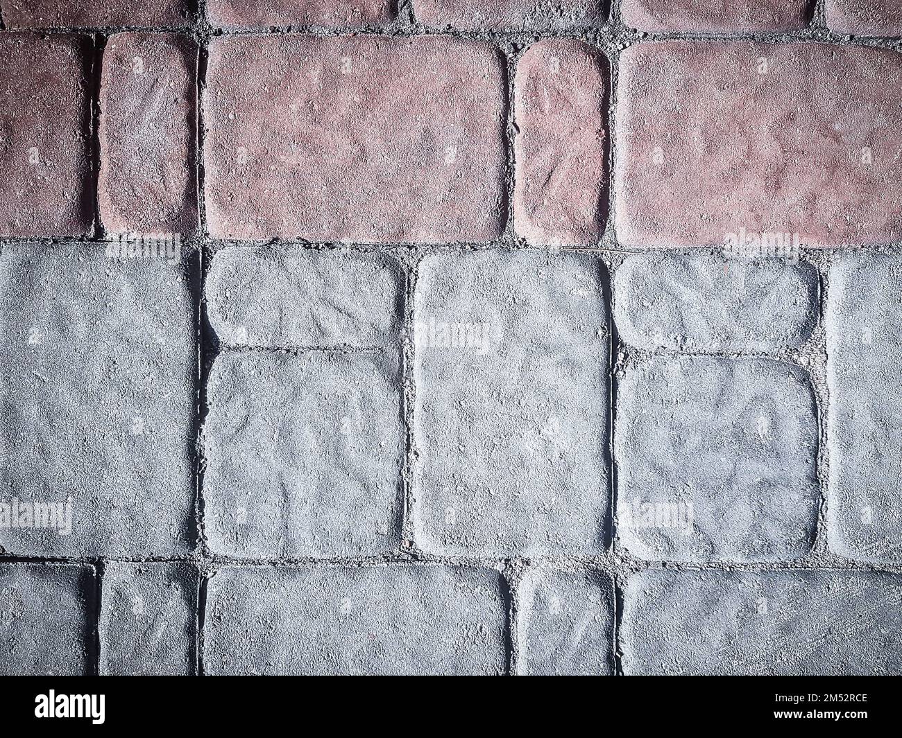 close-up . a fragment of a red-white pavement pavement Stock Photo - Alamy