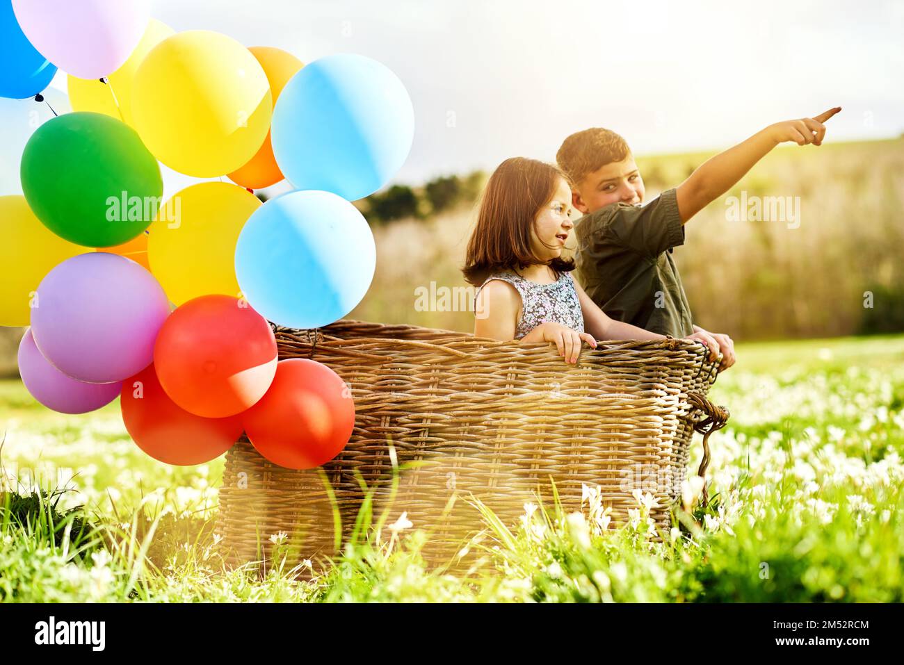 Lets Go See Whats Behind That Cloud A Pair Of Adorable Siblings Playing With A Basket And A