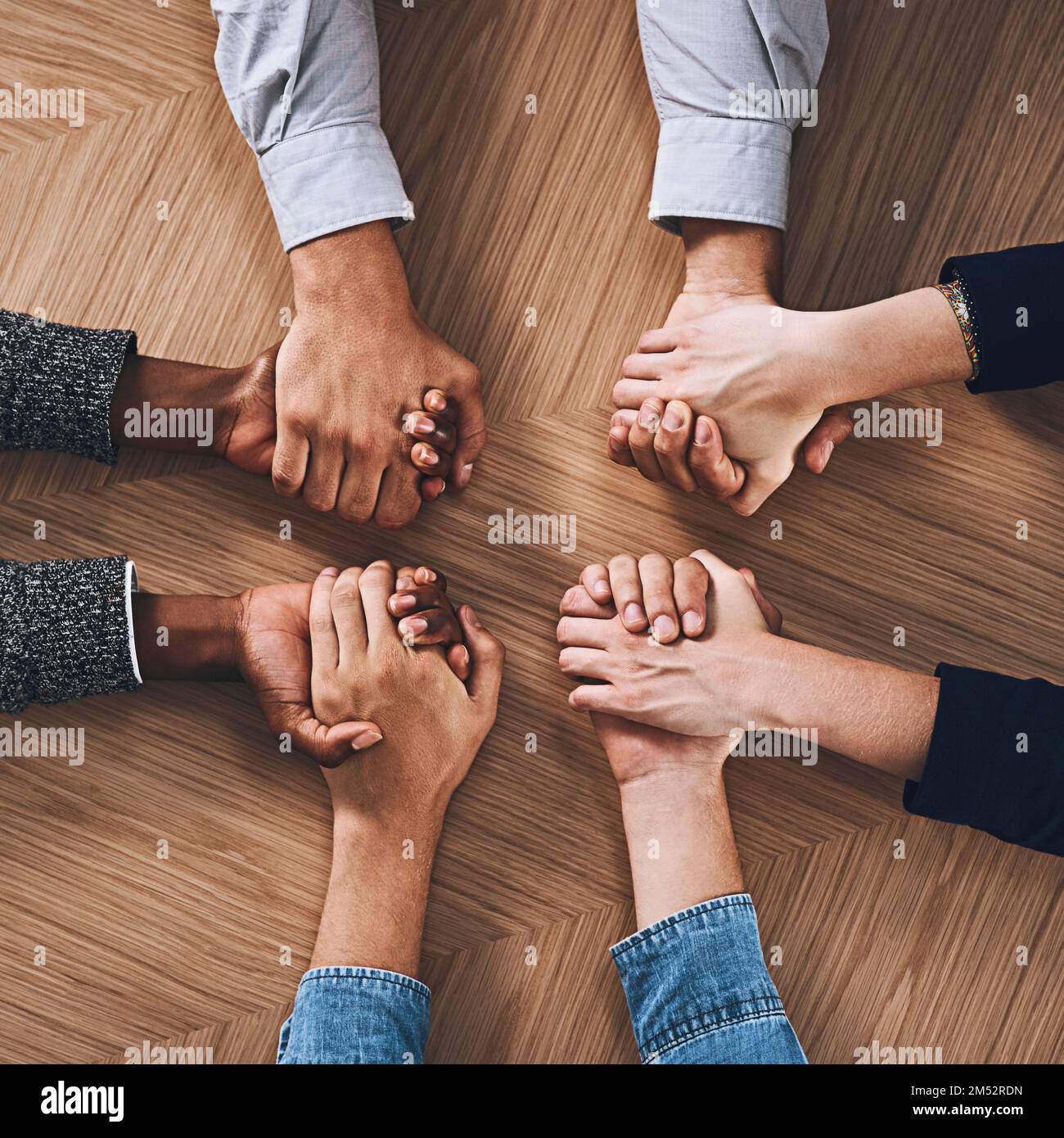 There is more power in unity than division. High angle shot of a group ...