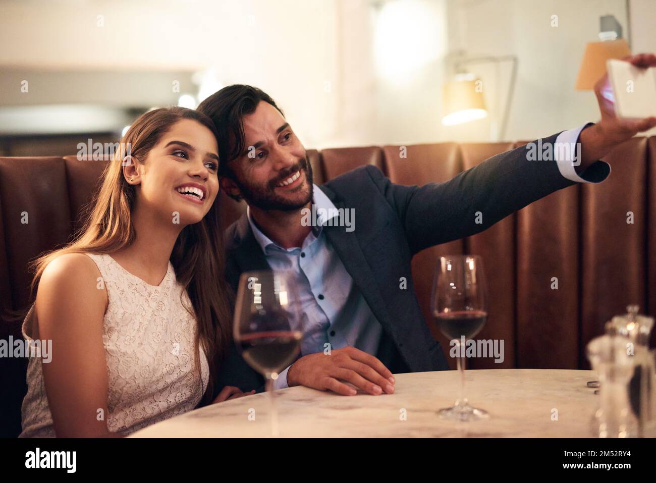 Always make time for a selfie. a young couple taking a selfie while on ...