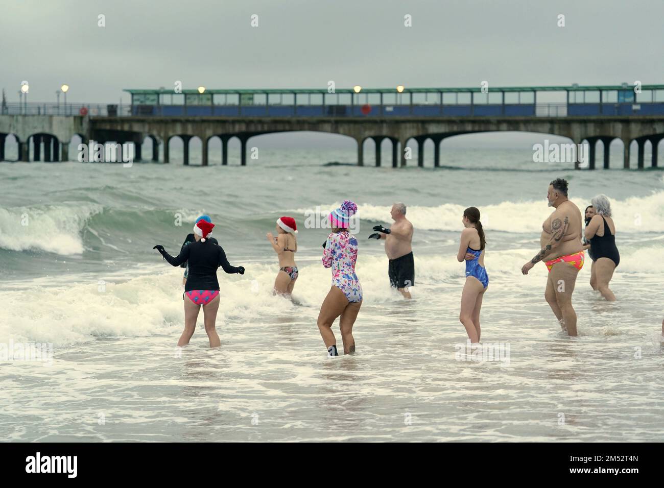 Swimmers take an early morning dip on Christmas Day, at Boscombe beach ...