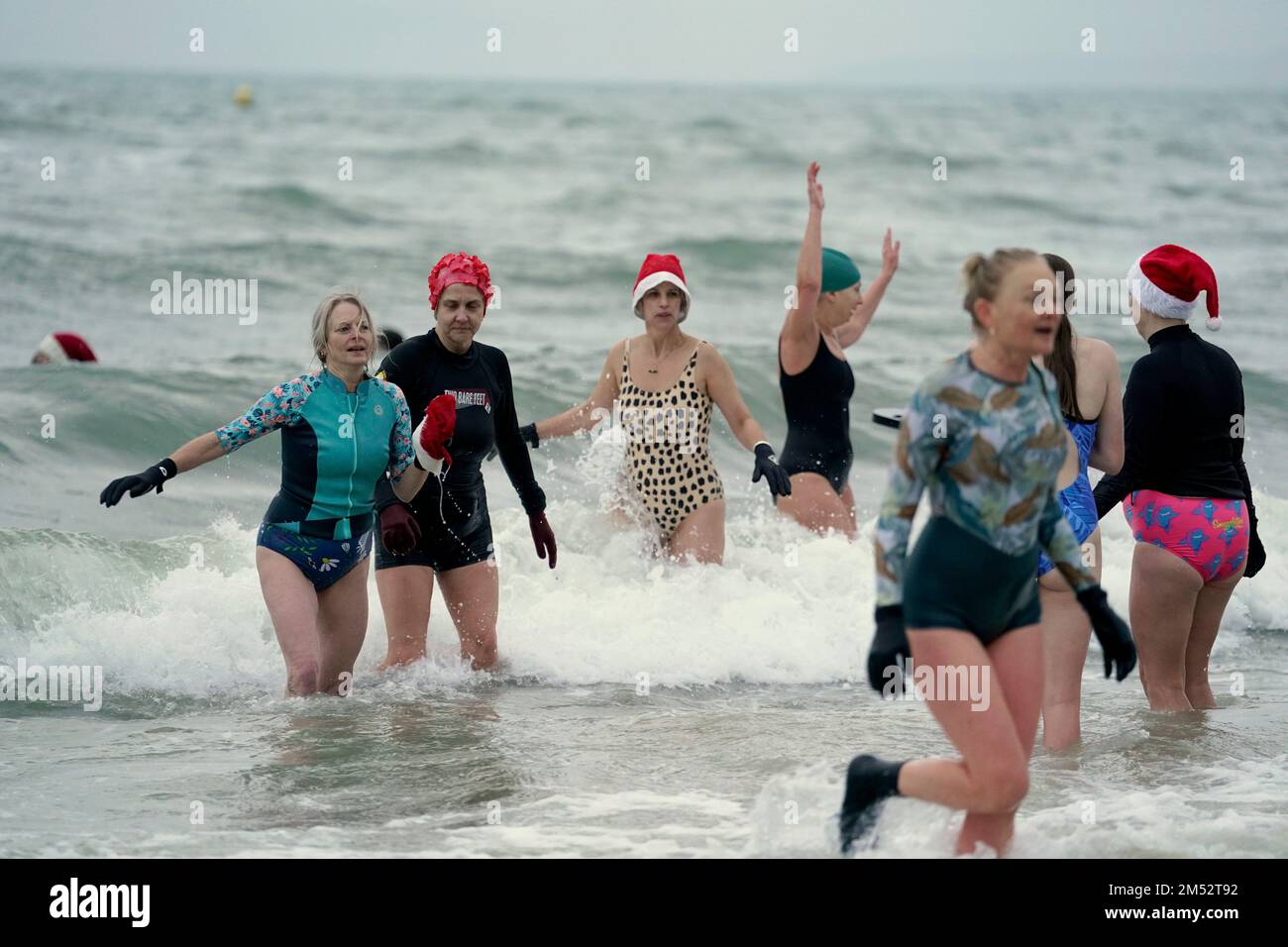 Swimmers take an early morning dip on Christmas Day, at Boscombe beach ...
