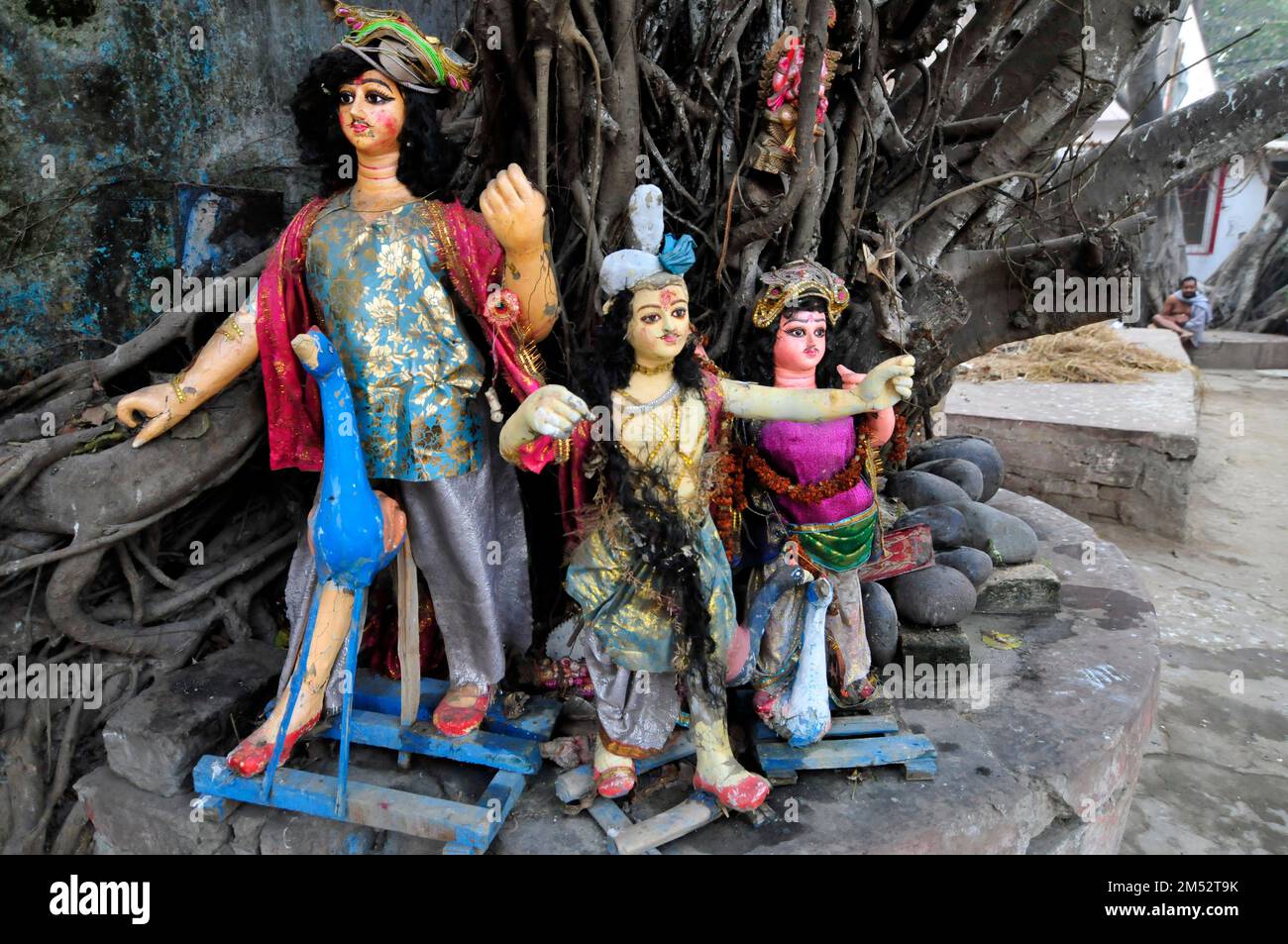 Colorful Hindu gods and goddesses by a small temple on Mallick Ghat in ...