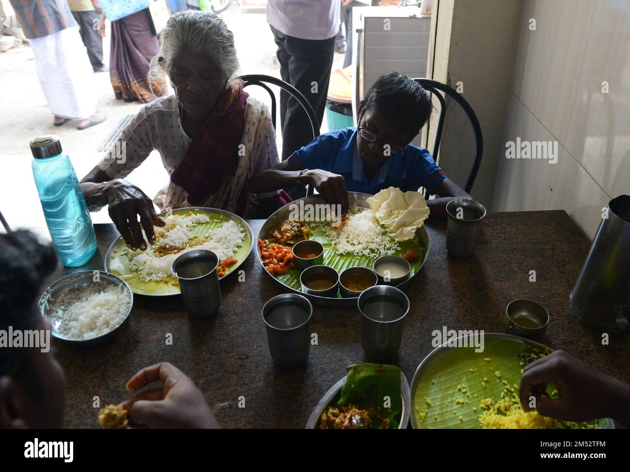 A traditional South Indian Thali meal served on a banana leaf in a ...