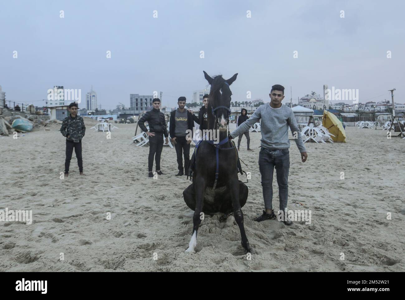 Gaza, Palestine. 24th Dec, 2022. A Palestinian man poses for a photo ...