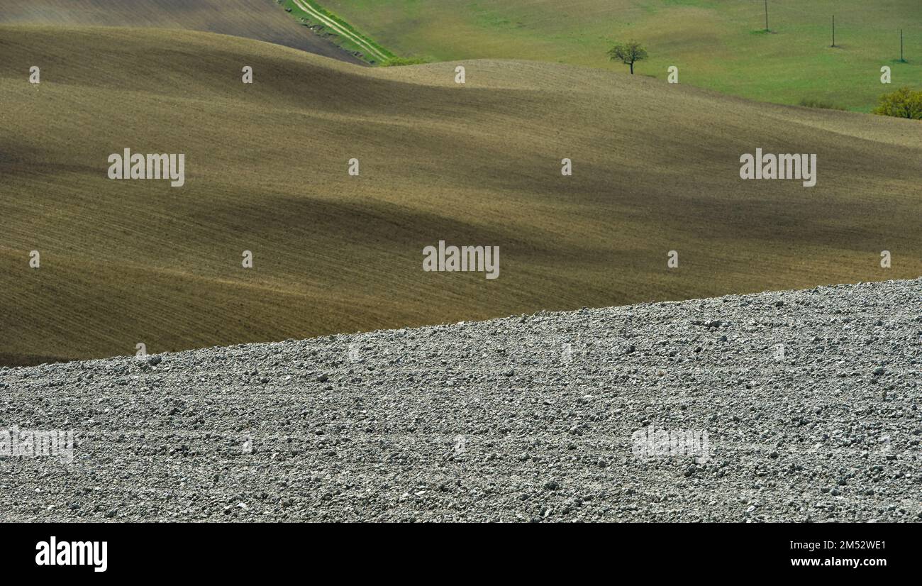 Ploughed hills of Tuscany on a spring day Stock Photo - Alamy