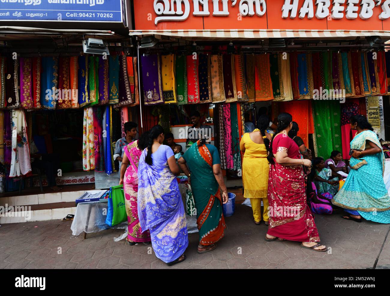 Tamil women buying saris at the vibrant old city of Madurai, Tamil Nadu ...