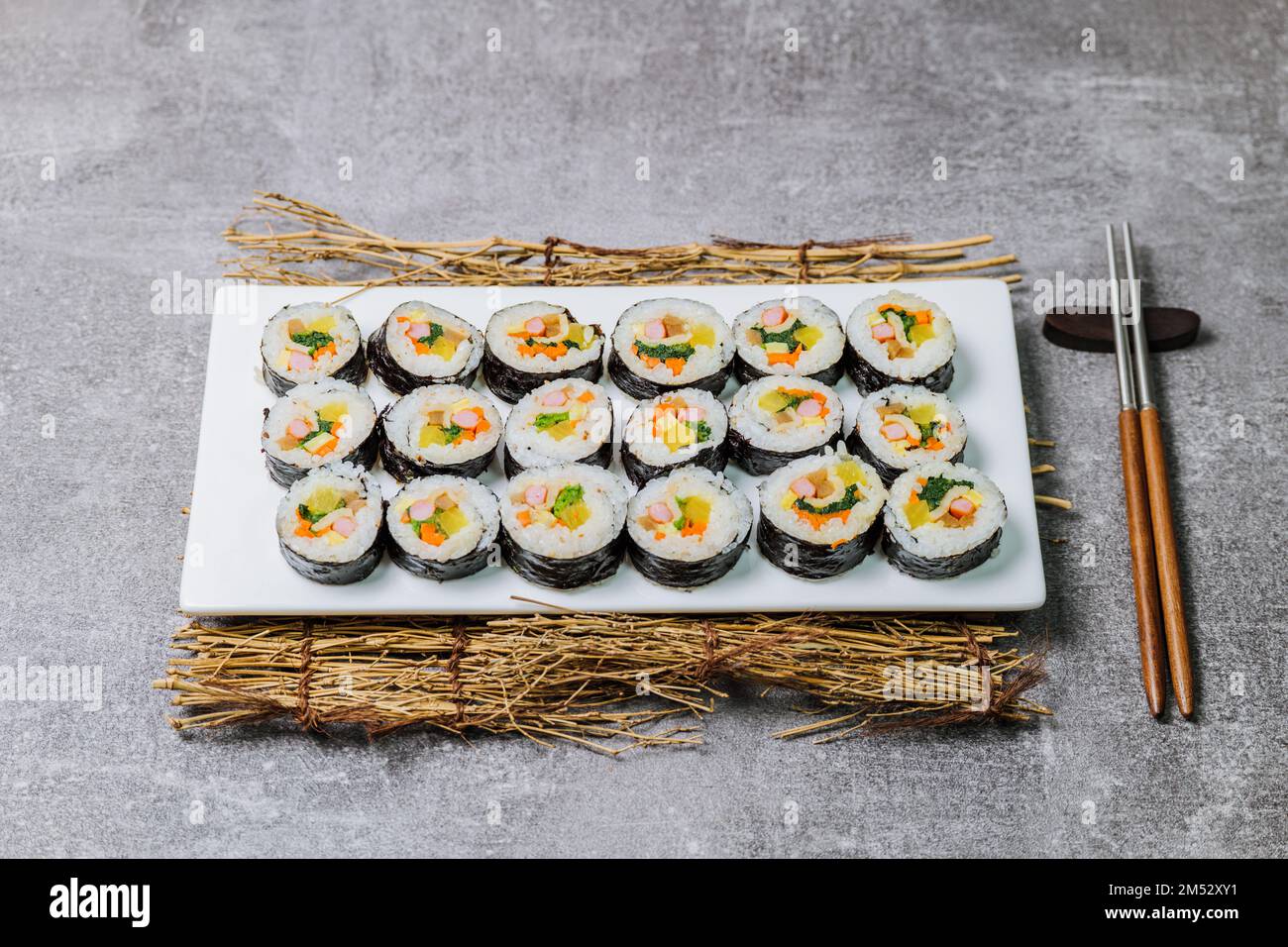 Rice seasoned with salt and sesame oil and rolled up in a sheet of ...