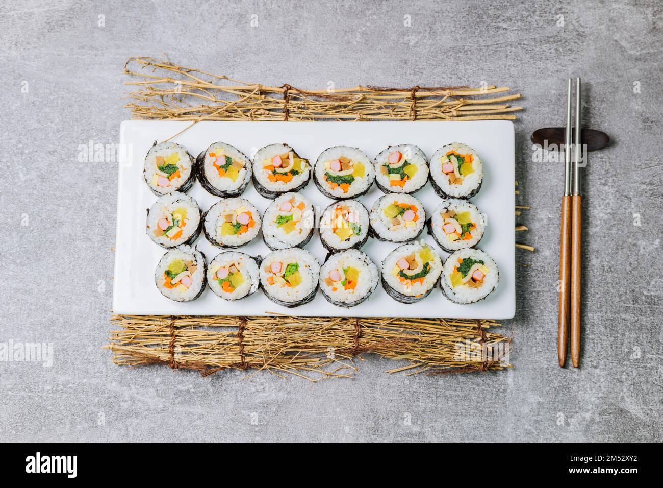 Rice seasoned with salt and sesame oil and rolled up in a sheet of ...