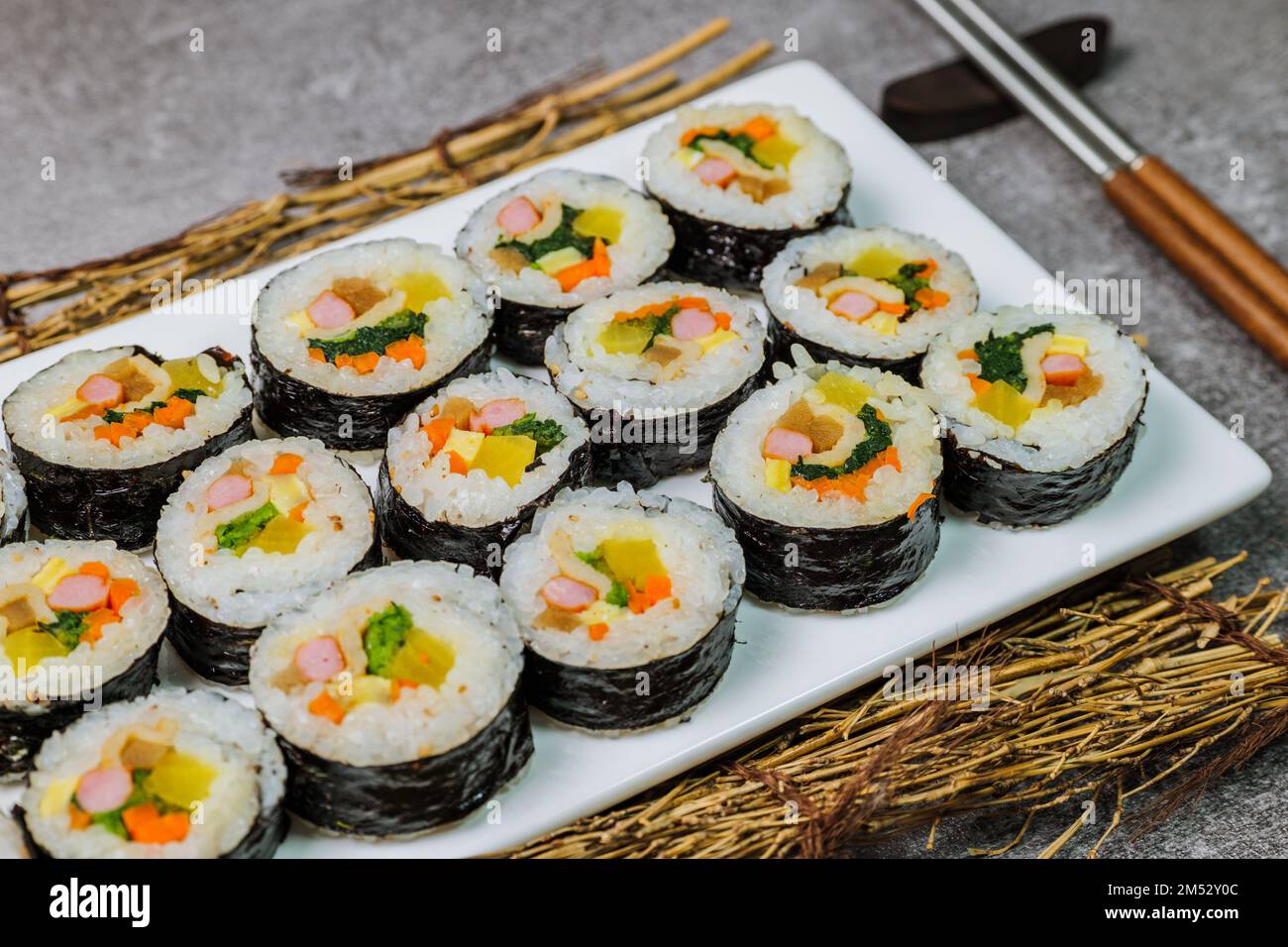 Rice seasoned with salt and sesame oil and rolled up in a sheet of ...