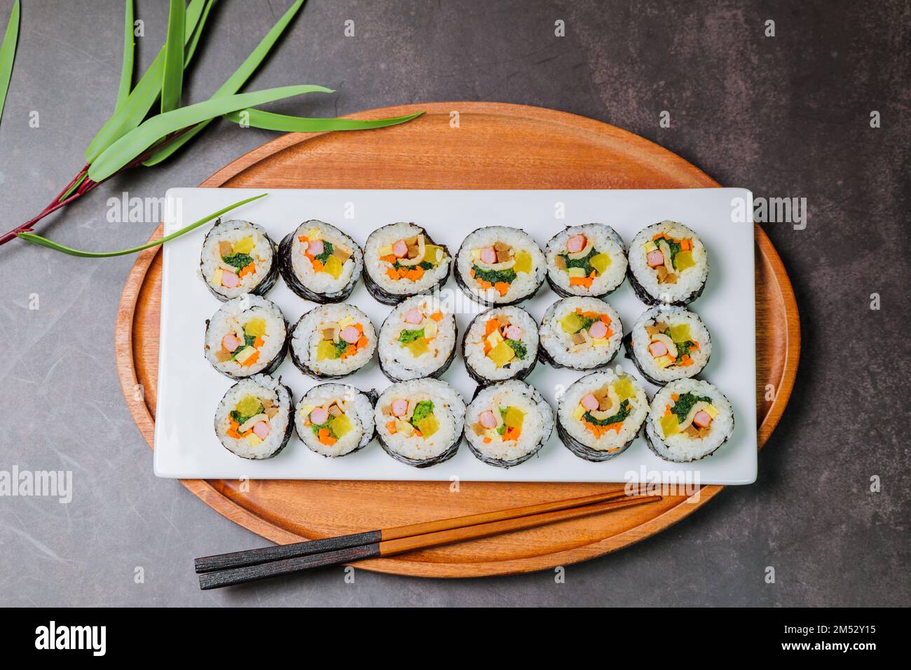 Rice seasoned with salt and sesame oil and rolled up in a sheet of ...