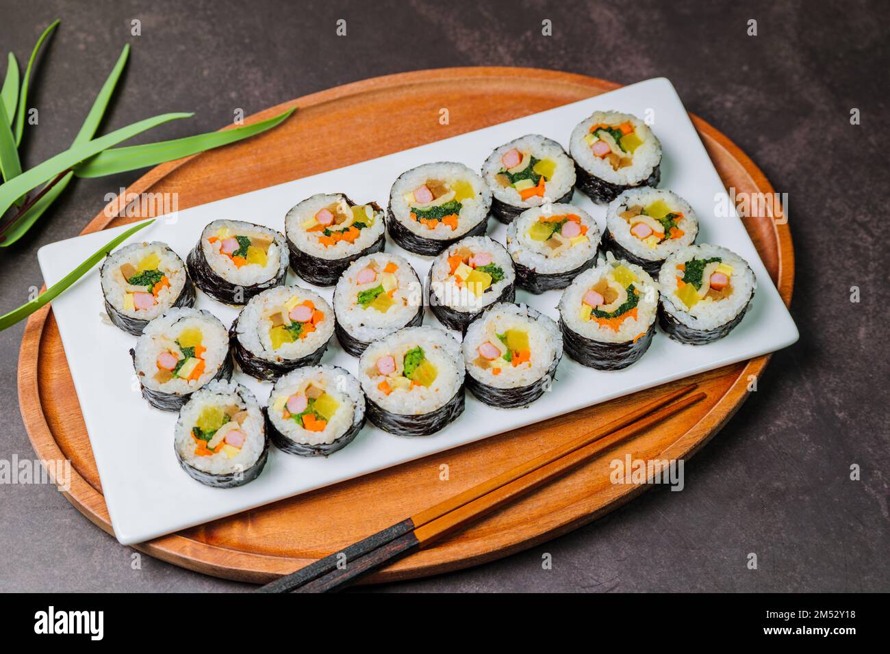 Rice seasoned with salt and sesame oil and rolled up in a sheet of ...