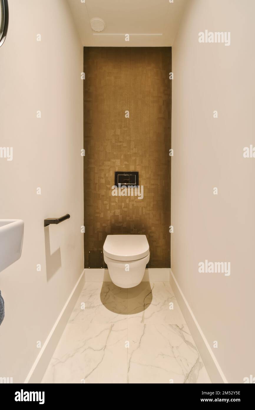 a modern bathroom with marble flooring and white walls, along with a ...