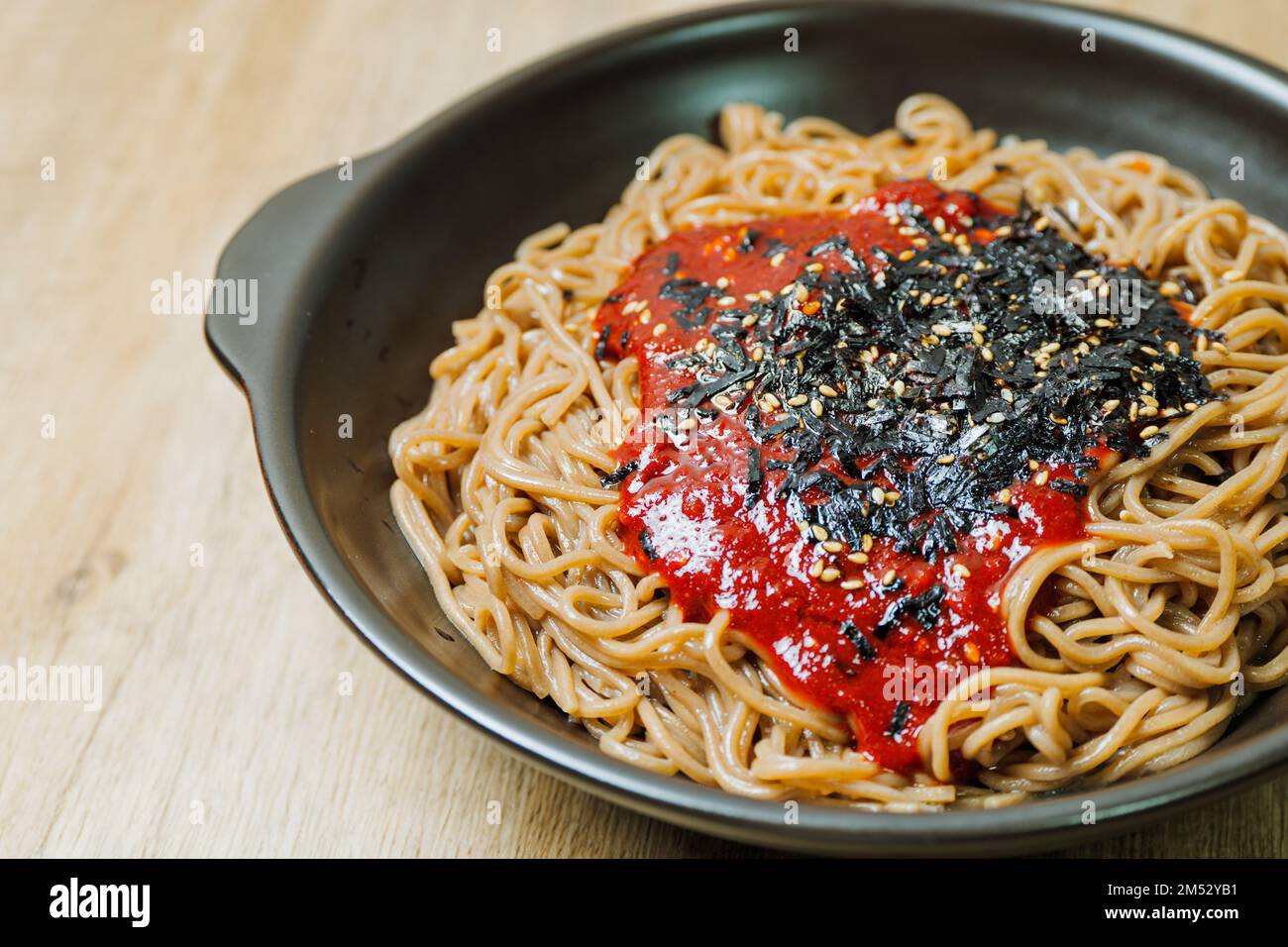 bibim memil makguksu, Korean style spicy buckwheat noodles Stock Photo ...