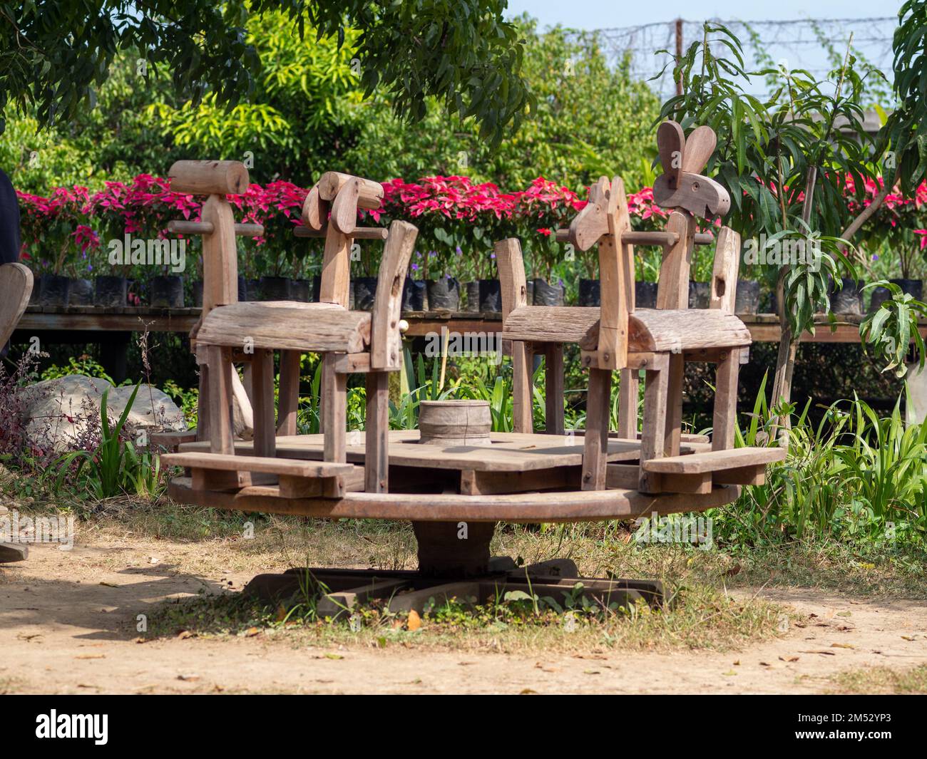 old carousel made of wood Stock Photo - Alamy