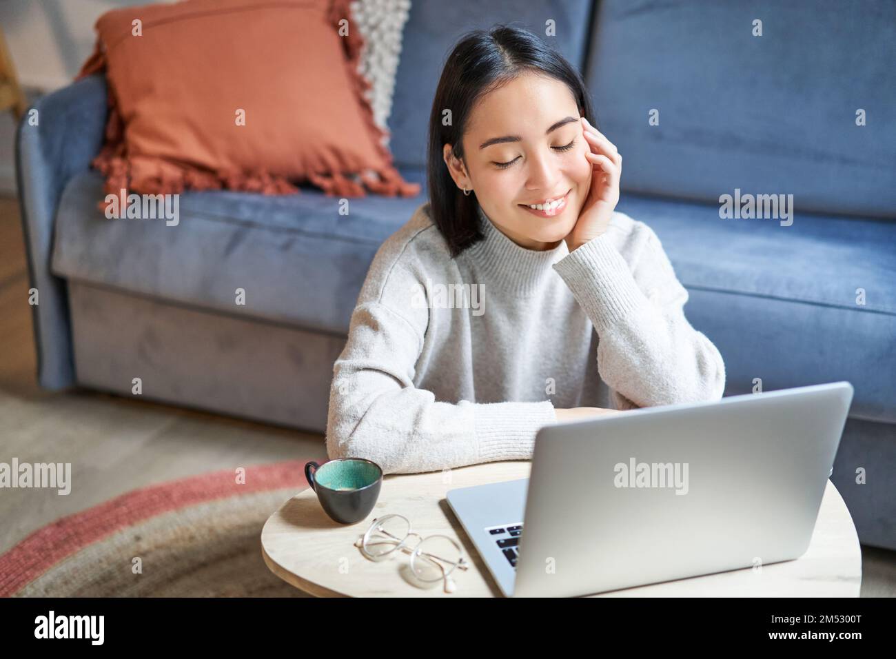 Beautiful asian girl works from home, studying with laptop, sitting in ...