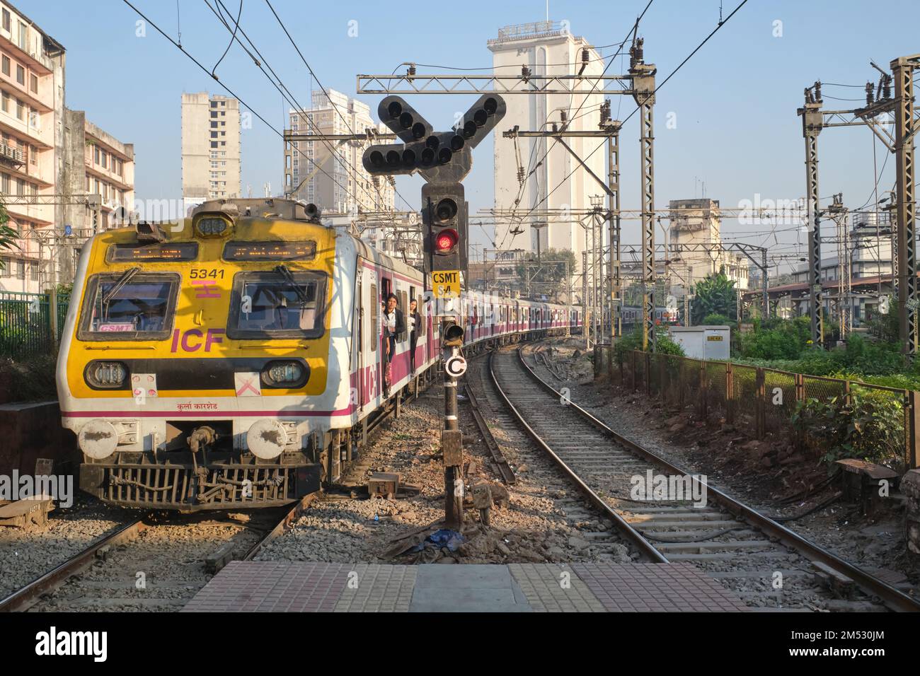 A local commuter train arriving at Chhatrapati Shivaji Maharaj Terminus ...