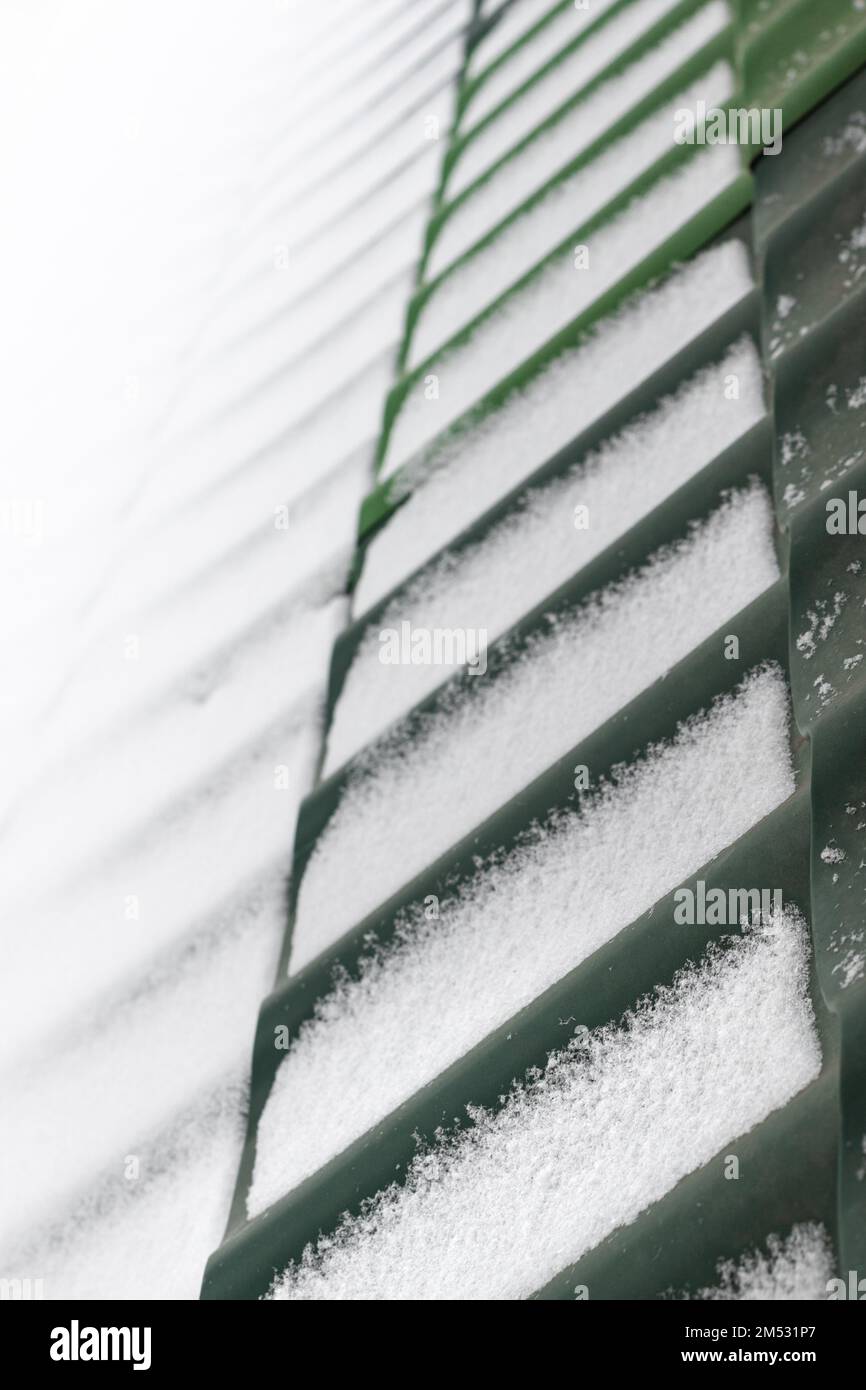 roof of a house covered with snow. house roof in winter. snow covered ...