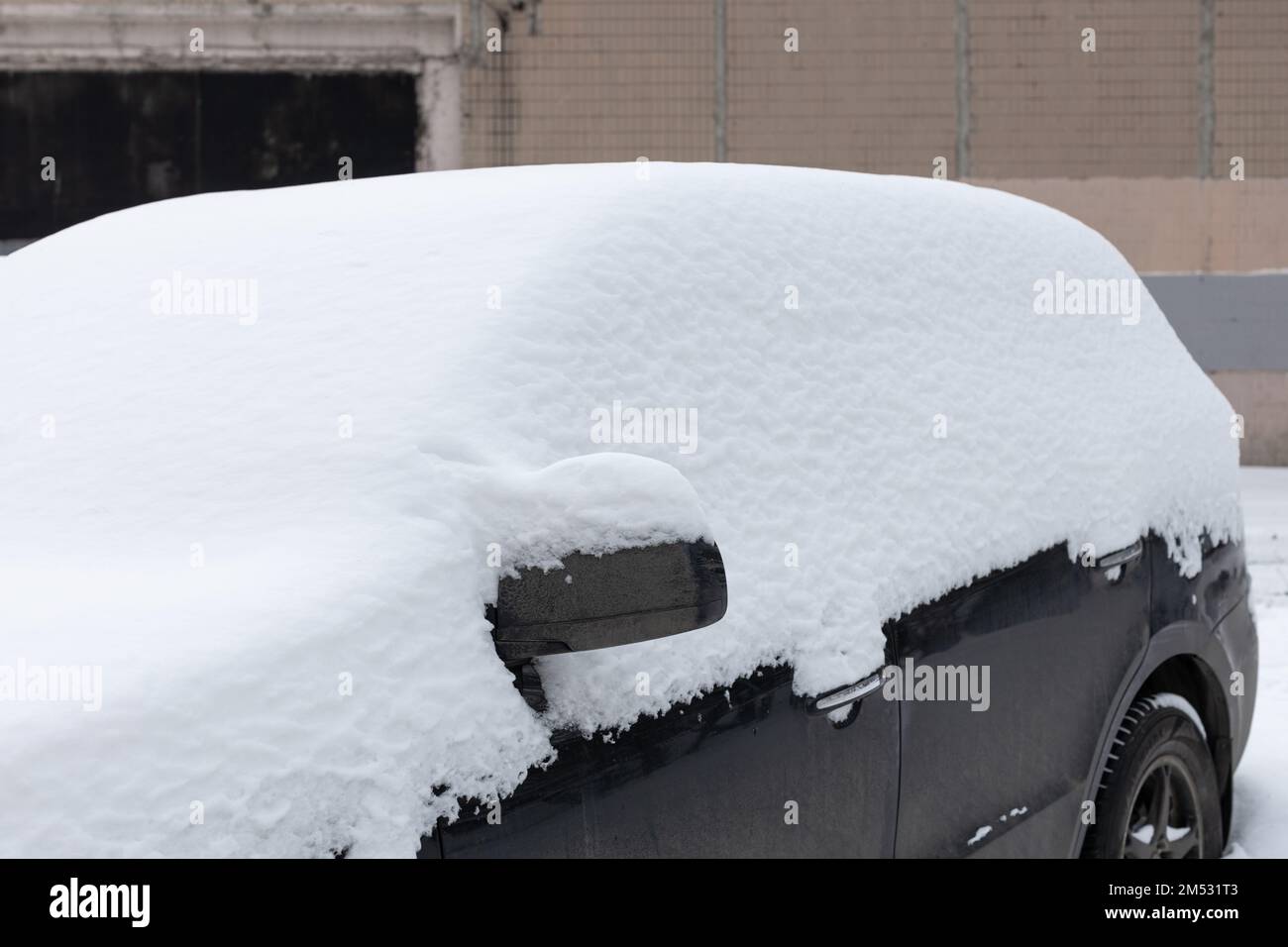 car covered with snow after a snowfall. car covered in snow. car parked ...