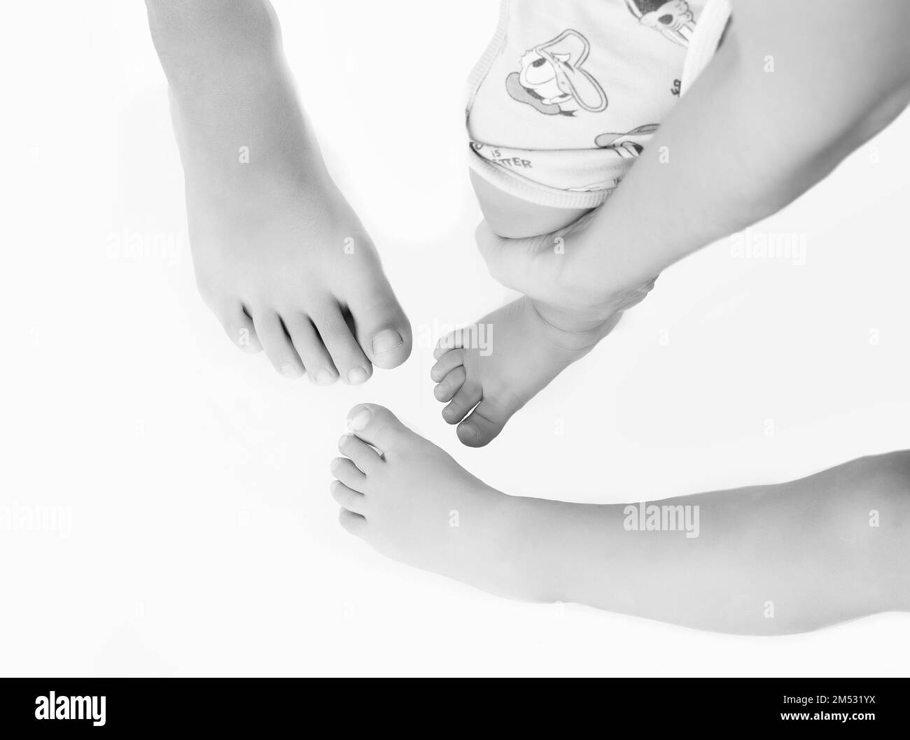 A grayscale shot of children's legs on a white background Stock Photo ...